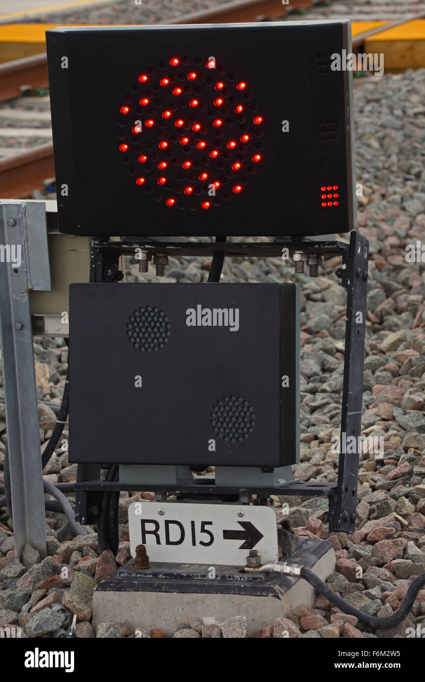 A matt black painted "Fixed red" aspect signal ground mounted with the ...