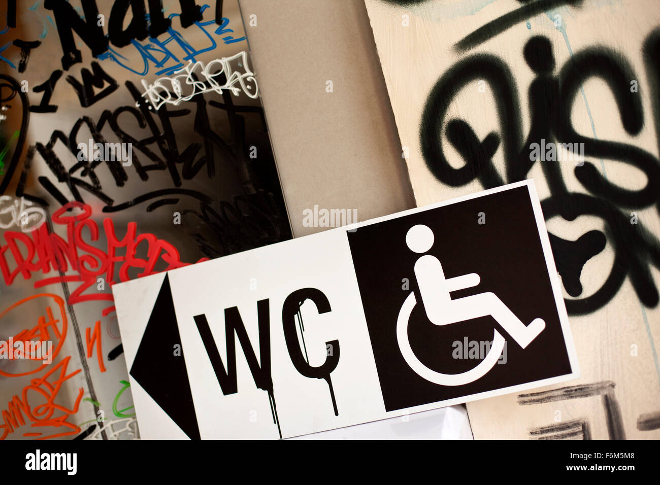 Close up of wc sign for disabled and graffiti in school Stock Photo - Alamy