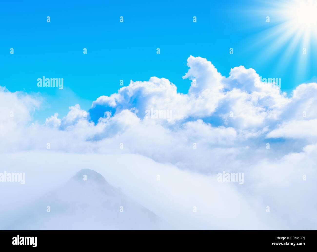 Fantastic cloudscape and sun at midday time Stock Photo - Alamy