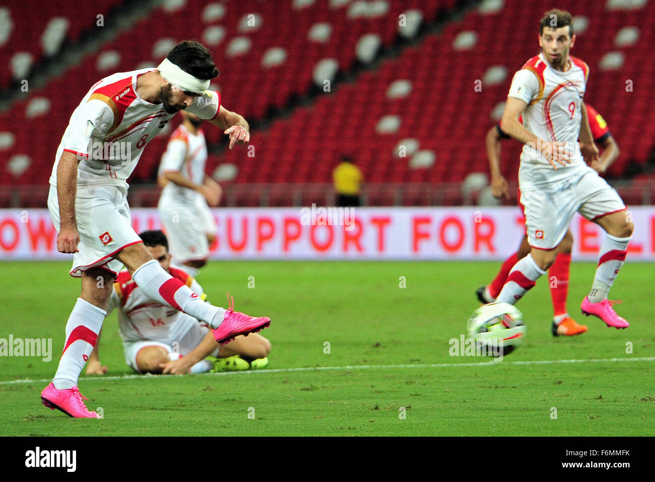 Singapore. 17th Nov, 2015. Omar Kharbin (L) of Syria shoots during a ...