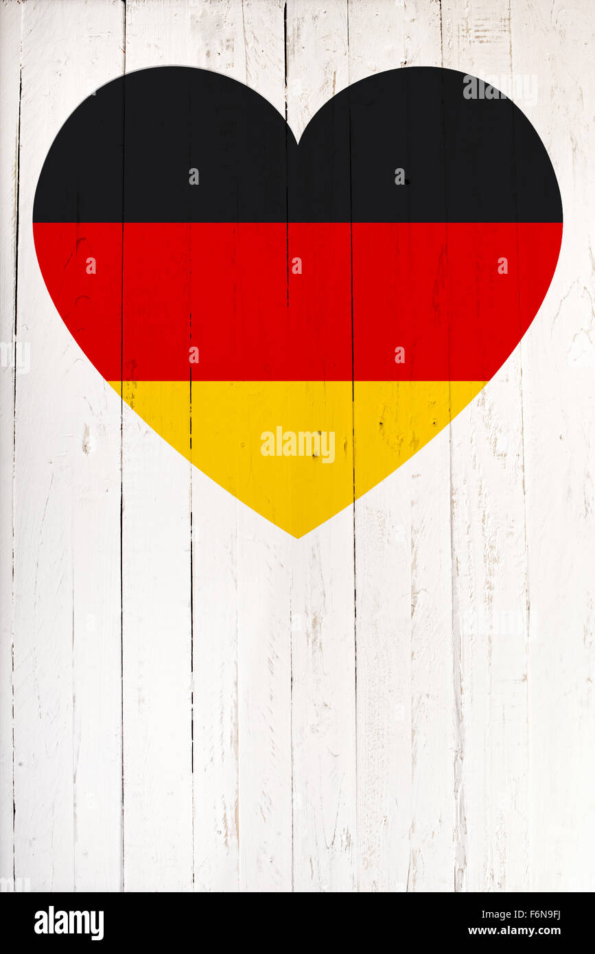 German flag in heart shape on a old white wooden board Stock Photo - Alamy