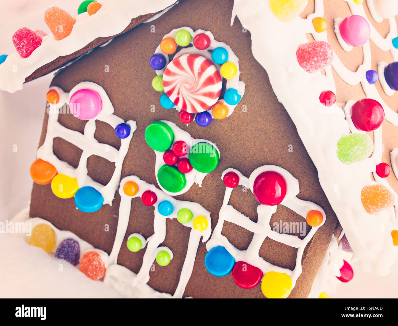 Decorated gingerbread house on red background Stock Photo - Alamy
