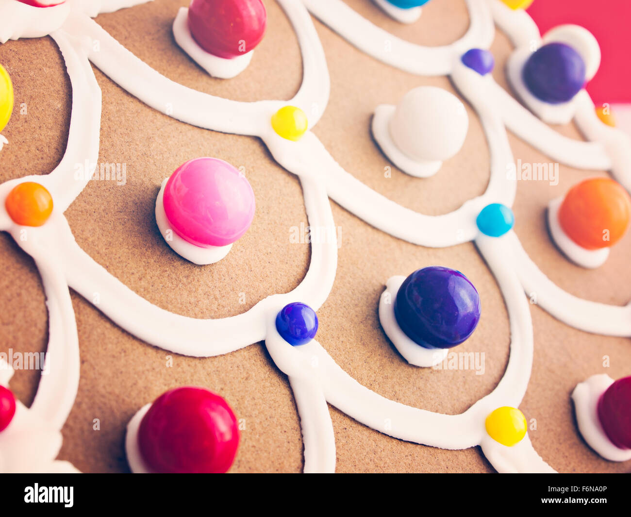 Decorated gingerbread house on red background Stock Photo - Alamy