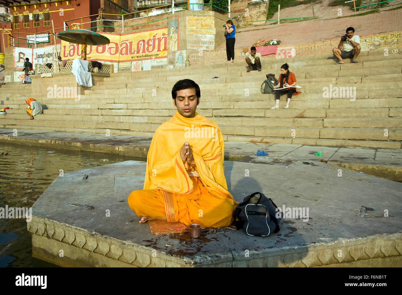 Pilgrims performing pooja meditation, varanasi, uttar pradesh, india ...
