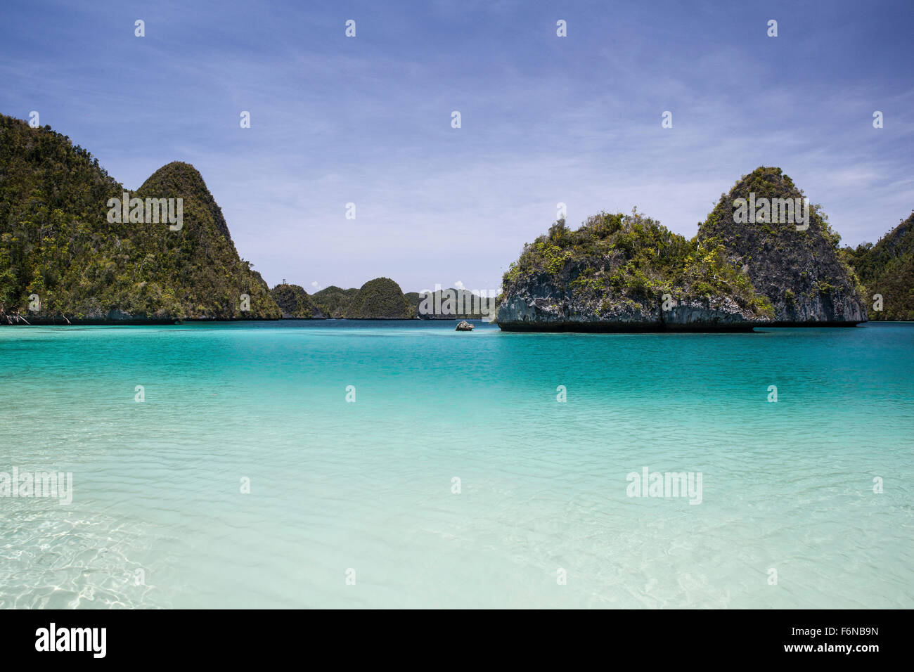 Rugged limestone islands surround a gorgeous lagoon in a remote part of ...