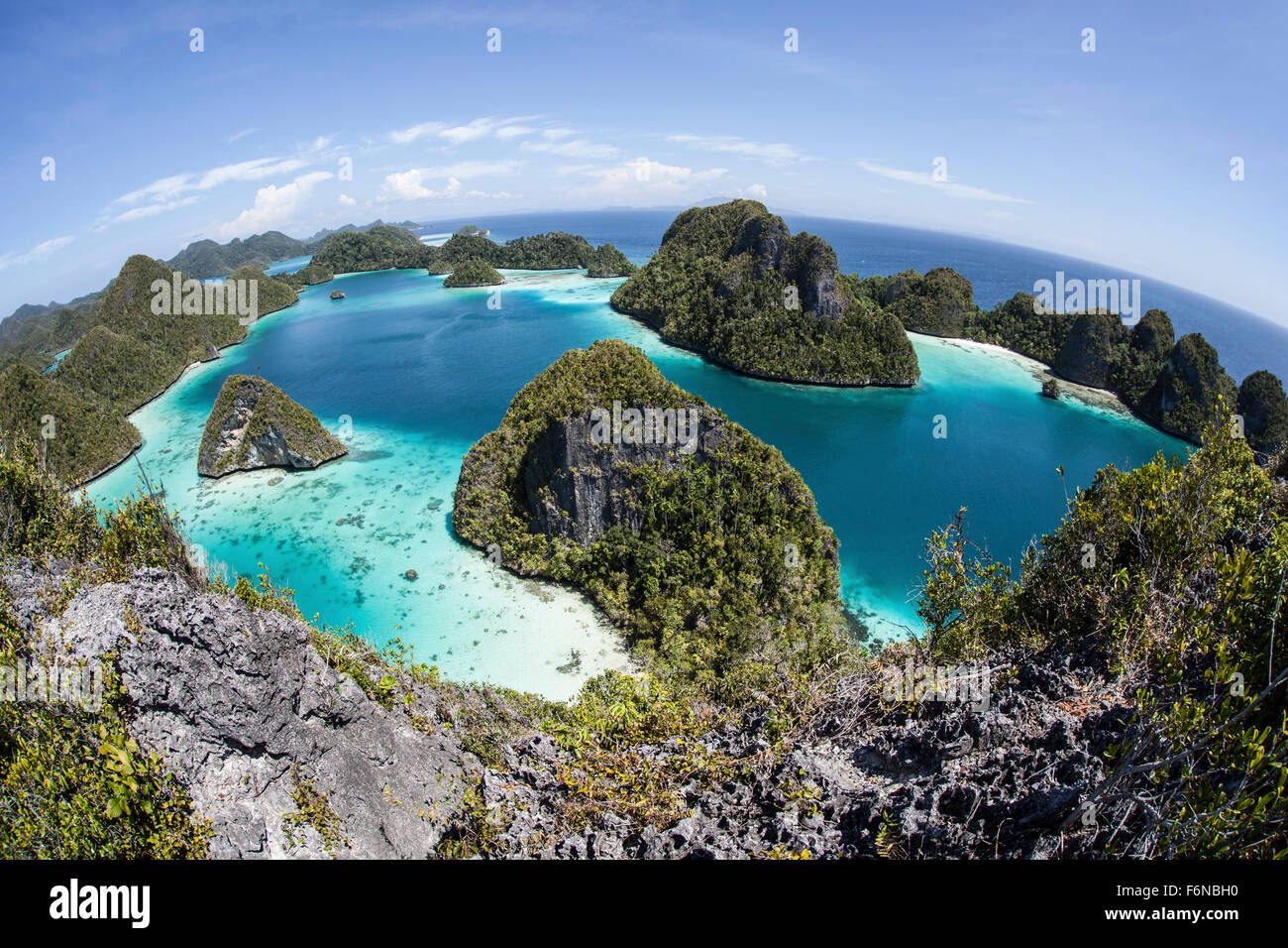 Rugged limestone islands surround a gorgeous lagoon in a remote part of ...