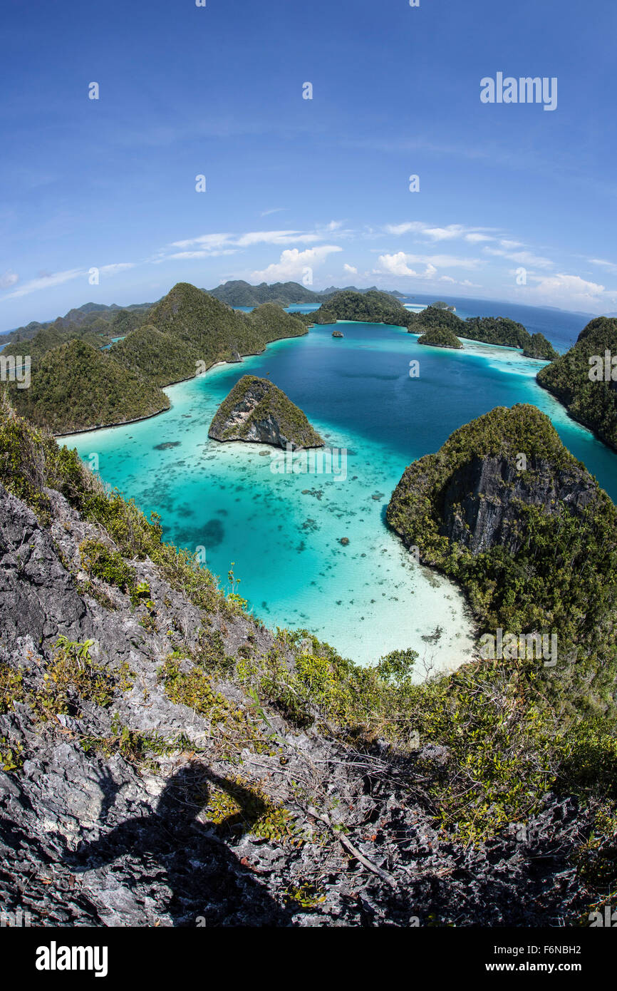 Rugged limestone islands surround a gorgeous lagoon in a remote part of ...