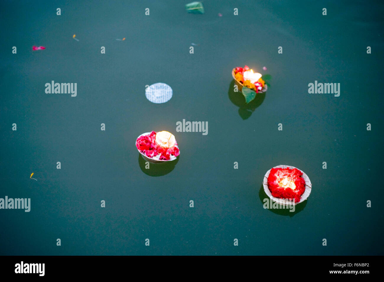 Oil lamp floating in ganga river, varanasi, uttar pradesh, india, asia ...