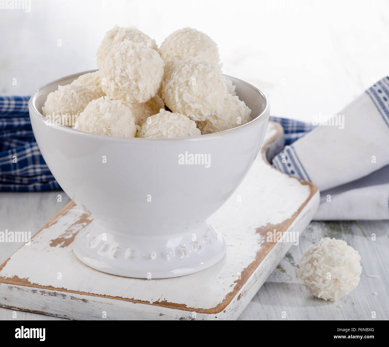 White chocolate coconut truffles in a bowl. Selective focus Stock Photo ...