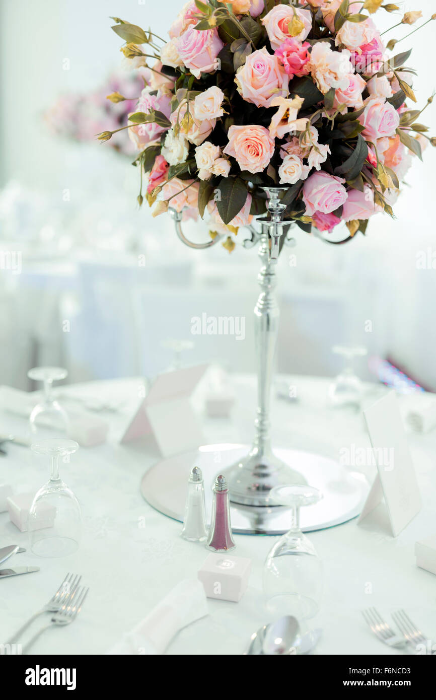 Beautiful decoration on wedding table with roses in bouquet Stock Photo ...