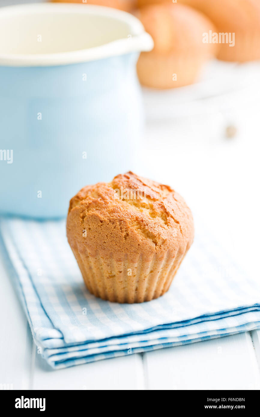 sweet muffins on white kitchen table Stock Photo - Alamy