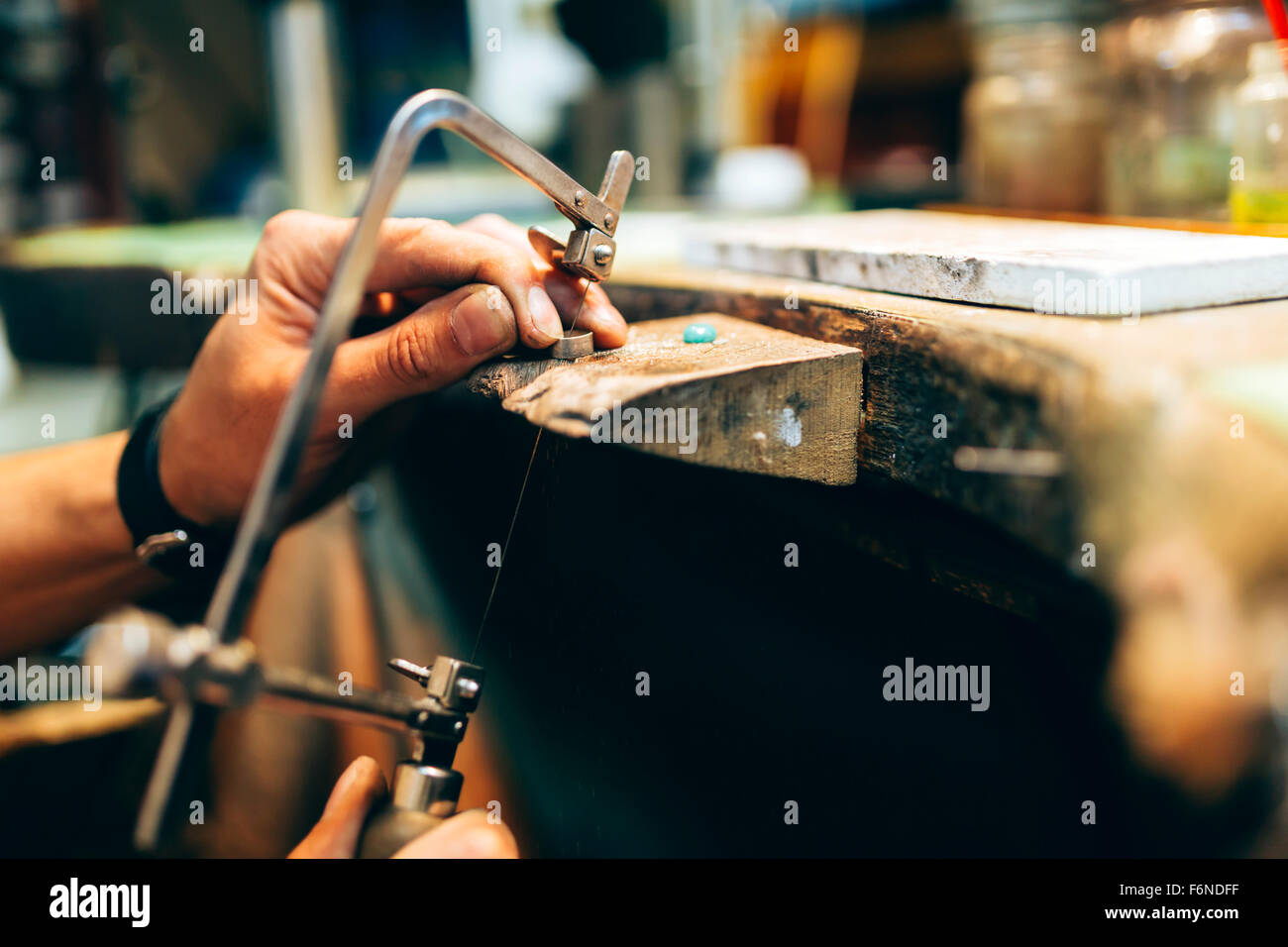 Jeweler creating jewelry Stock Photo - Alamy