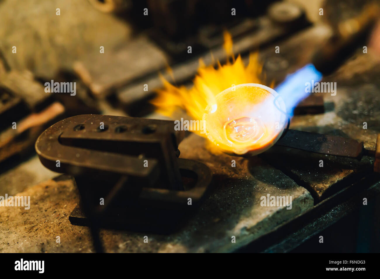 Jeweler welding gold the traditional way Stock Photo - Alamy