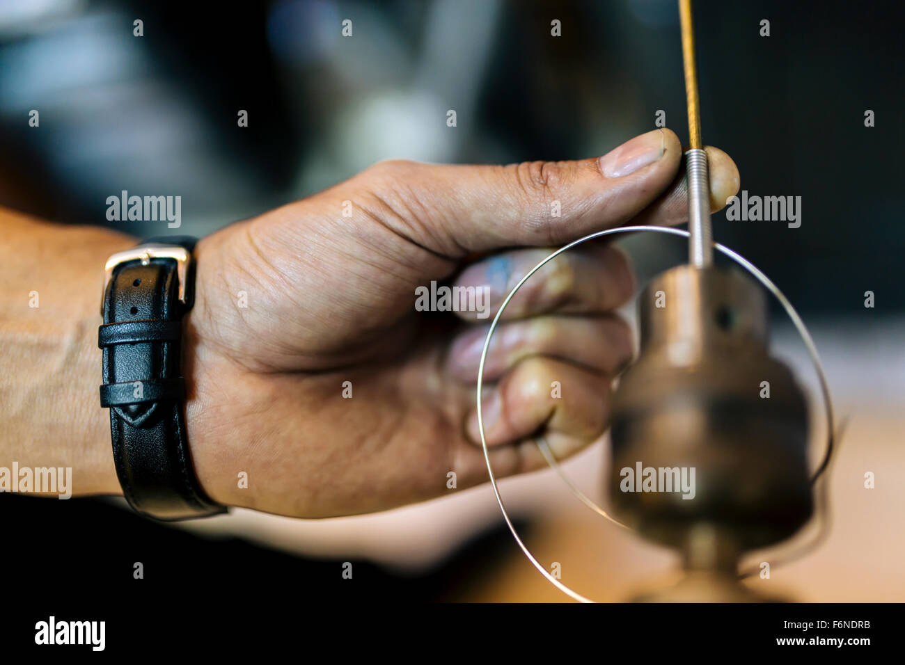 DIY, metal string wrapped around drill Stock Photo - Alamy