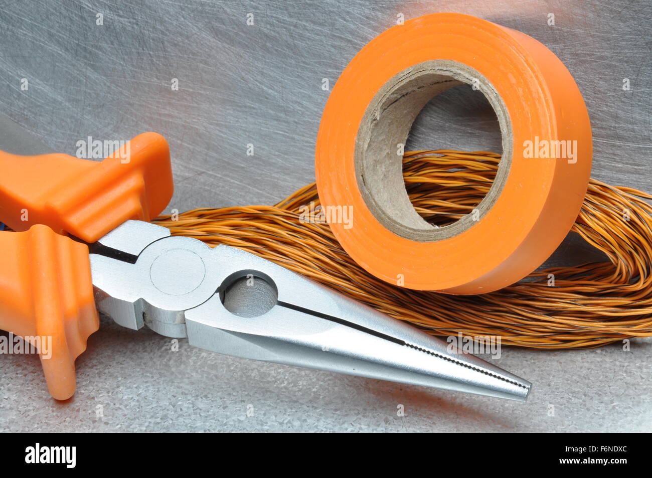 Tools and electrical component on metal surface with place for text ...