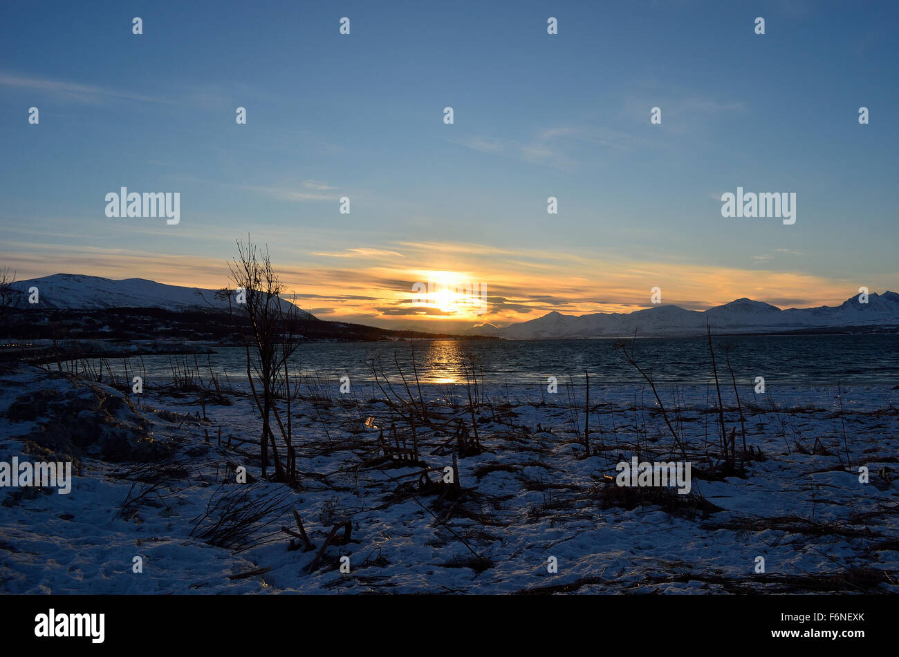 Deep landscape with sunshine,ocean,snow covered mountain range and ice ...