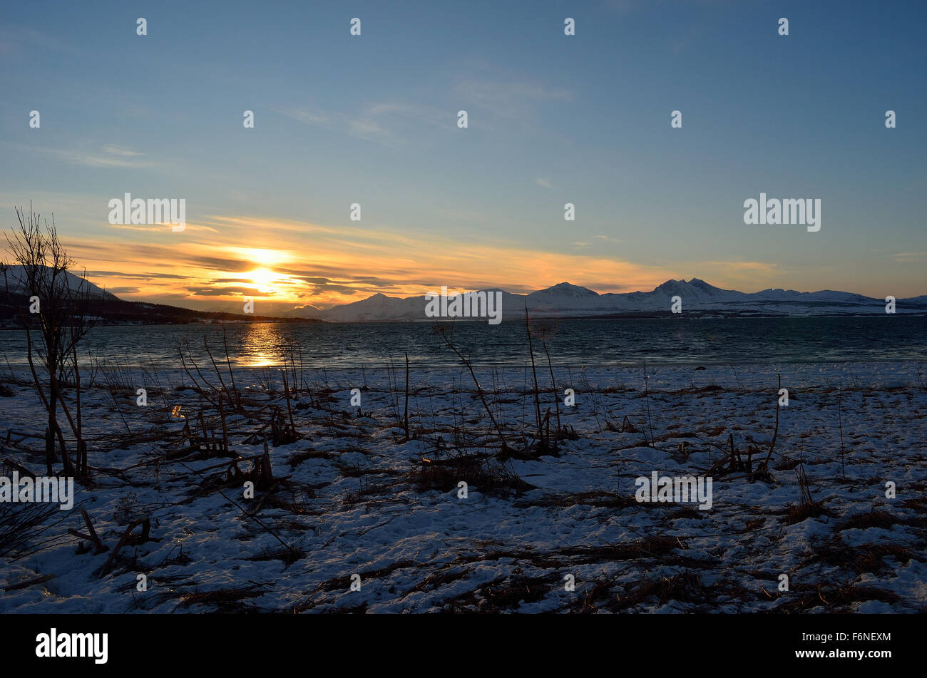 Deep landscape with sunshine,ocean,snow covered mountain range and ice ...