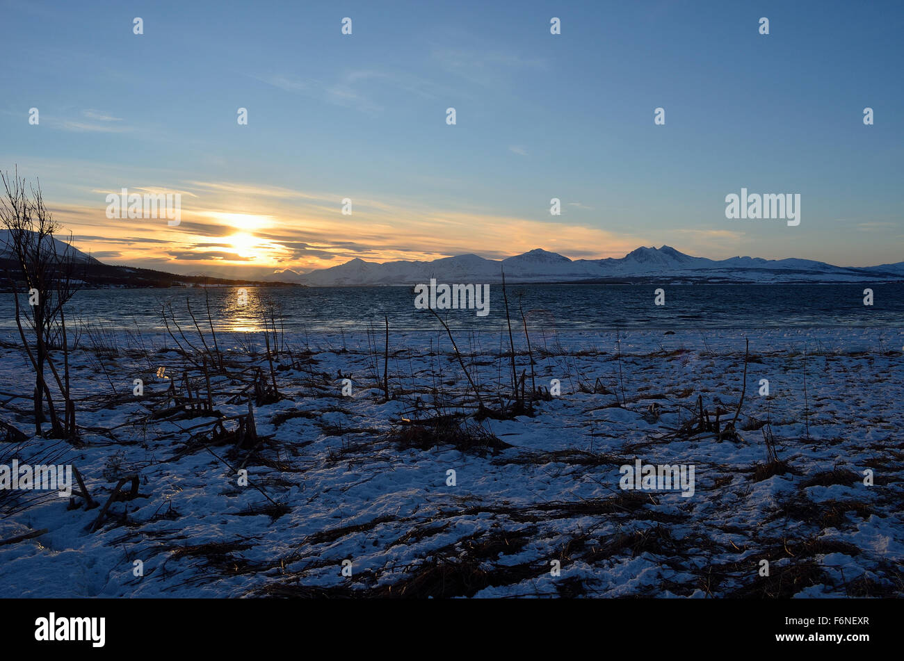 Deep landscape with sunshine,ocean,snow covered mountain range and ice ...