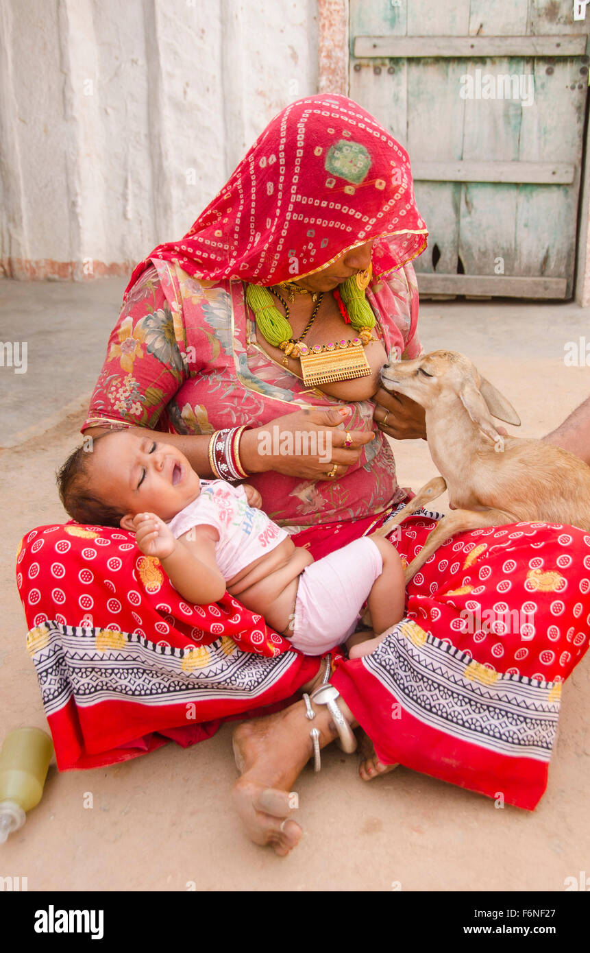 Woman feeding fawn, baby deer, jodhpur, rajasthan, india, asia, MR#786 ...