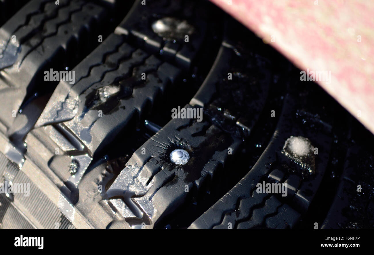 spiked, studded winter snow tire for car Stock Photo - Alamy