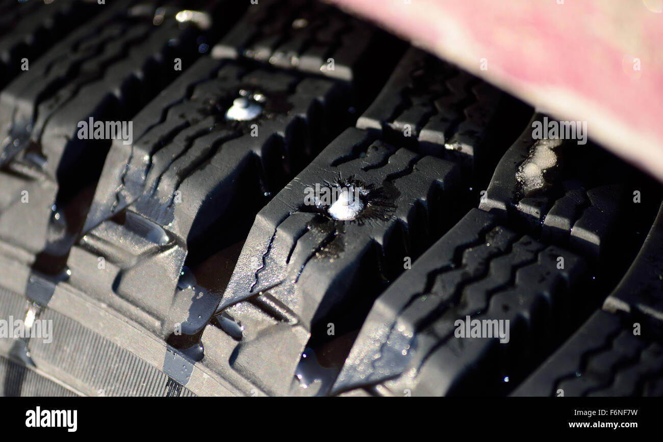 spiked, studded winter snow tire for car Stock Photo - Alamy