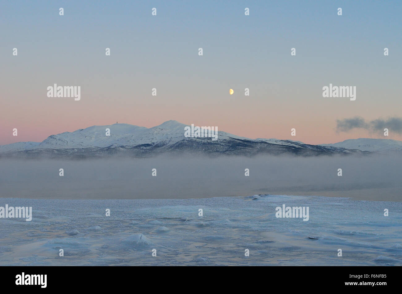 heavy eerie sea frost mist and fog over icy sea landscape with colorful ...