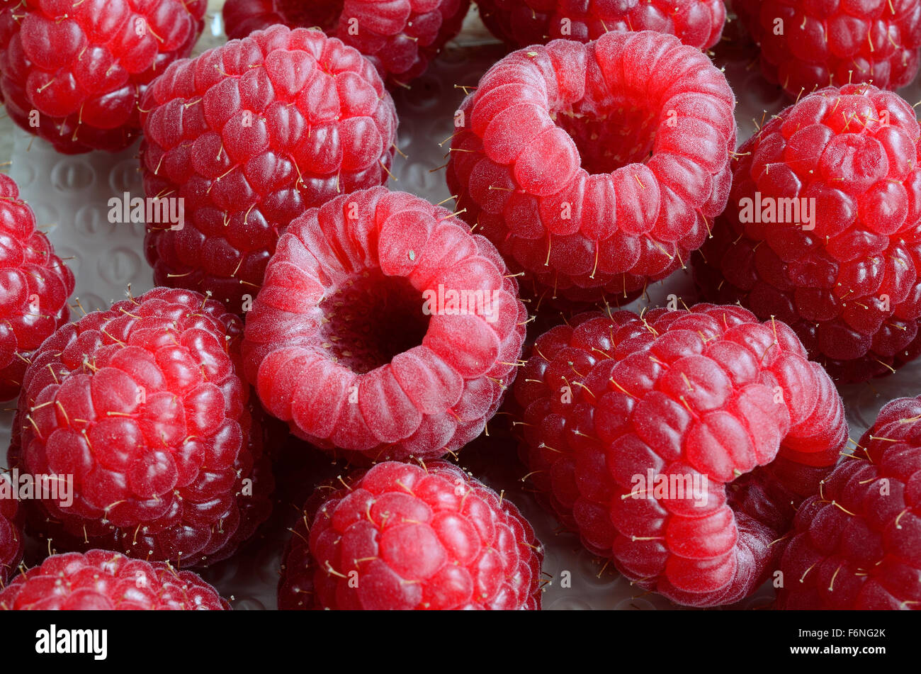 red ripe raspberry macro photo Stock Photo - Alamy