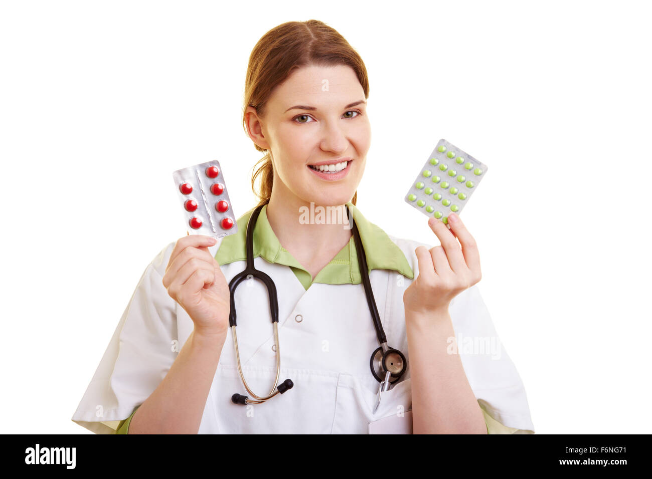 Female docotor offering a red and green kind of pills Stock Photo - Alamy