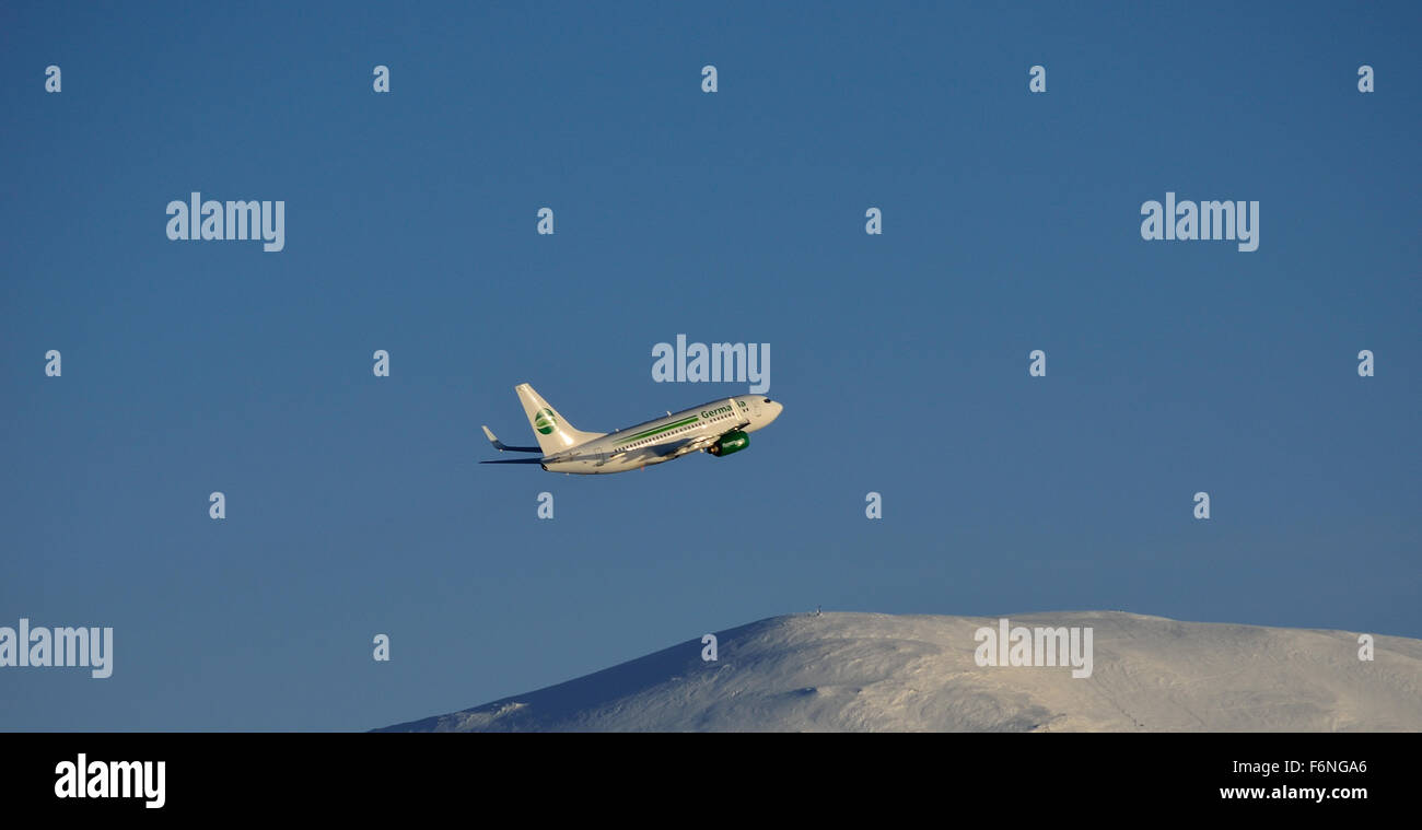 passenger airplane climbing on blue winter sky Stock Photo - Alamy