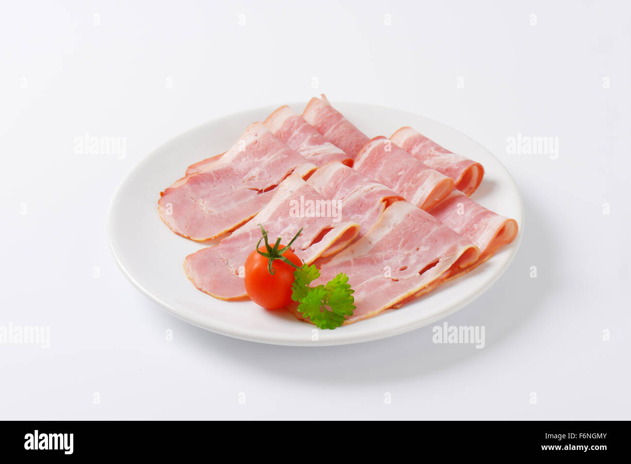 plate of fresh bacon slices on white background Stock Photo - Alamy