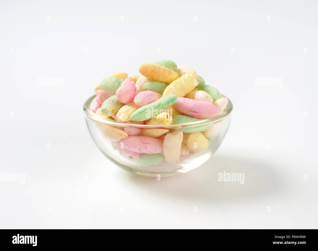 bowl of colorful puffed rice on white background Stock Photo - Alamy