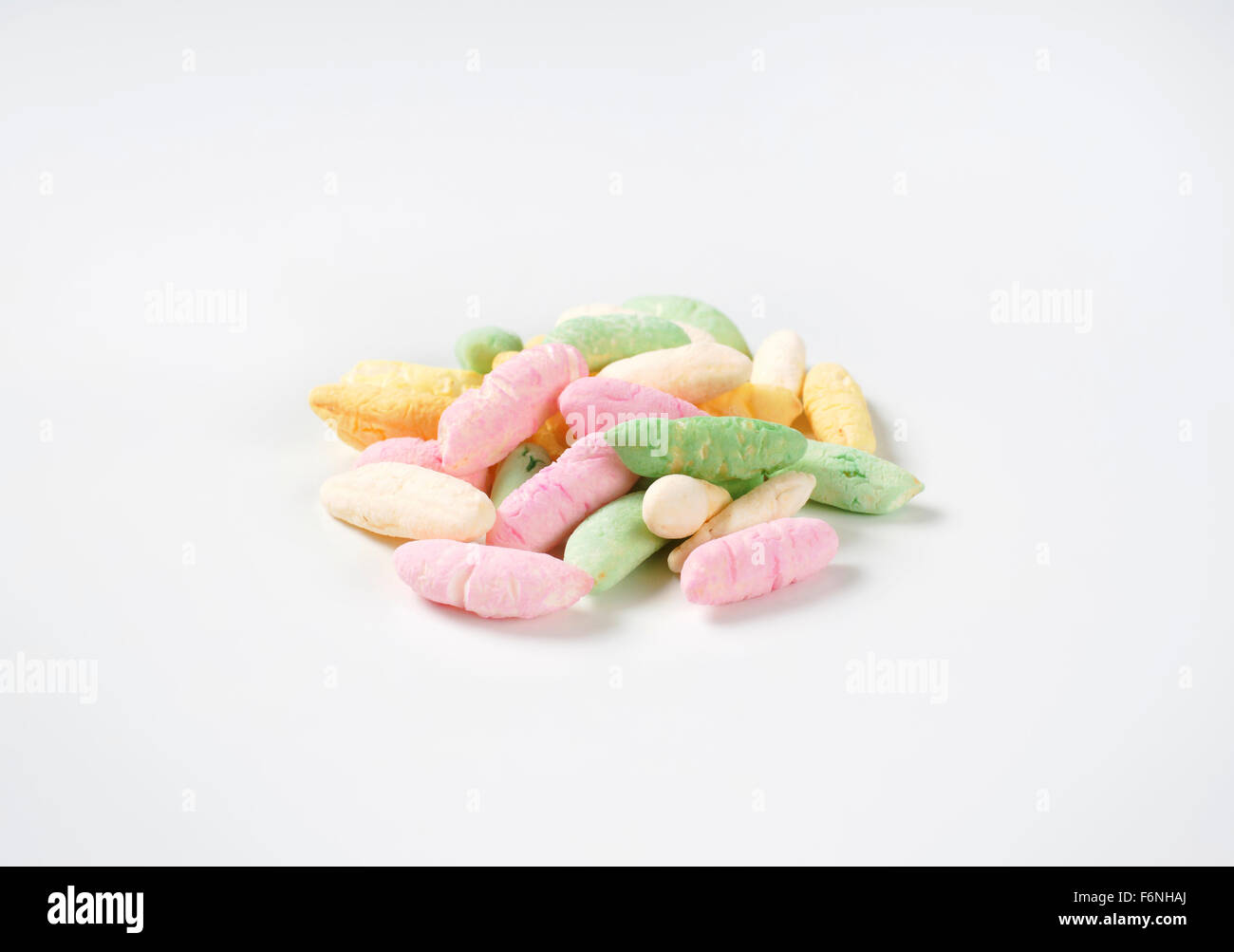 handful of colorful puffed rice on white background Stock Photo - Alamy