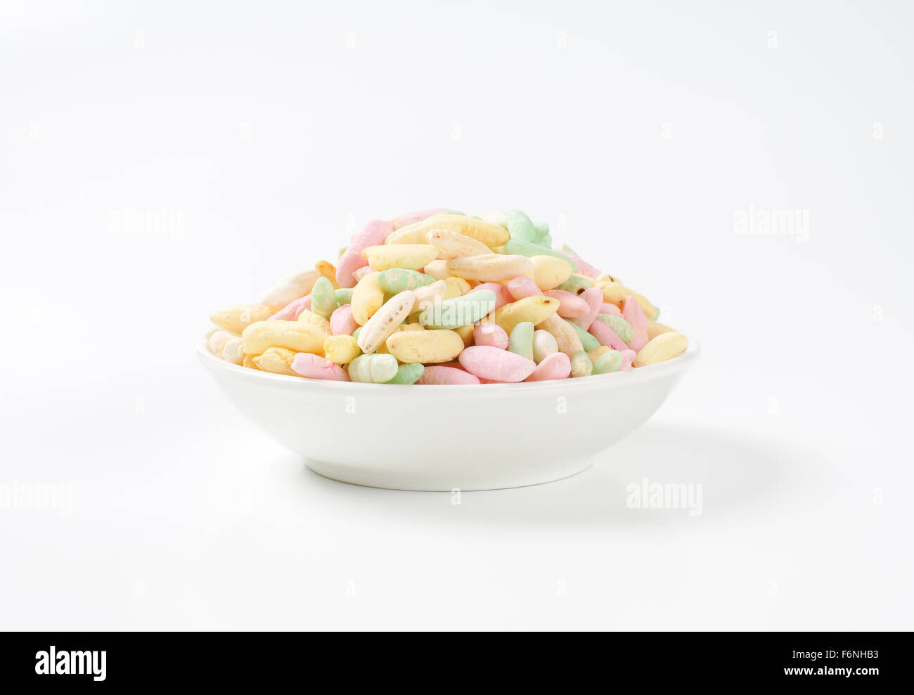 bowl of colorful puffed rice on white background Stock Photo - Alamy