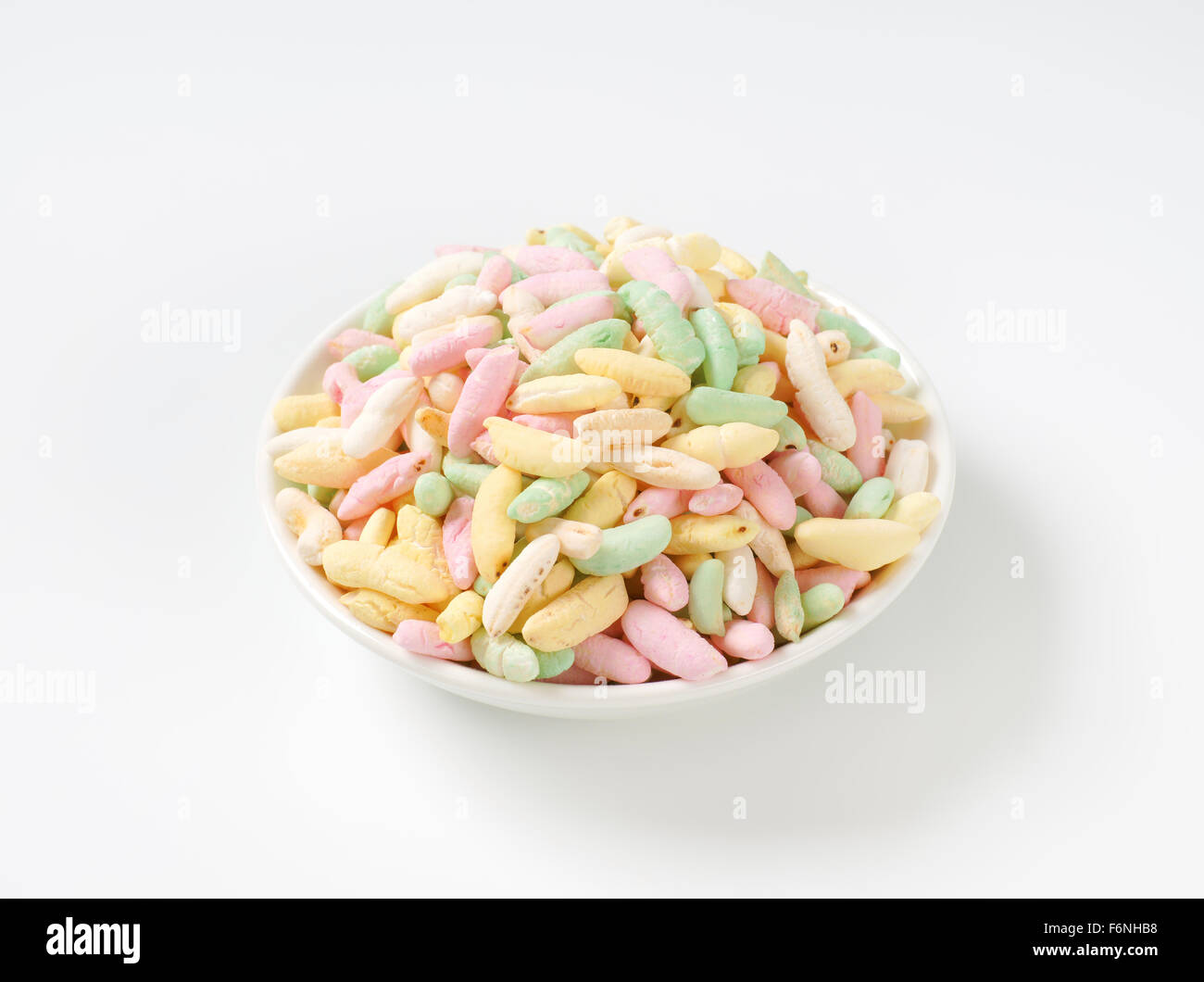 bowl of colorful puffed rice on white background Stock Photo - Alamy
