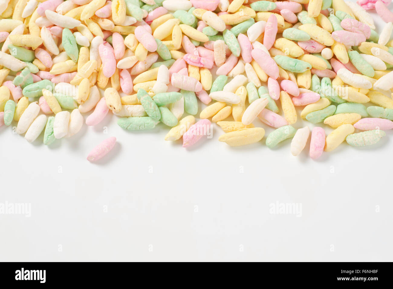 colorful puffed rice on white background Stock Photo - Alamy