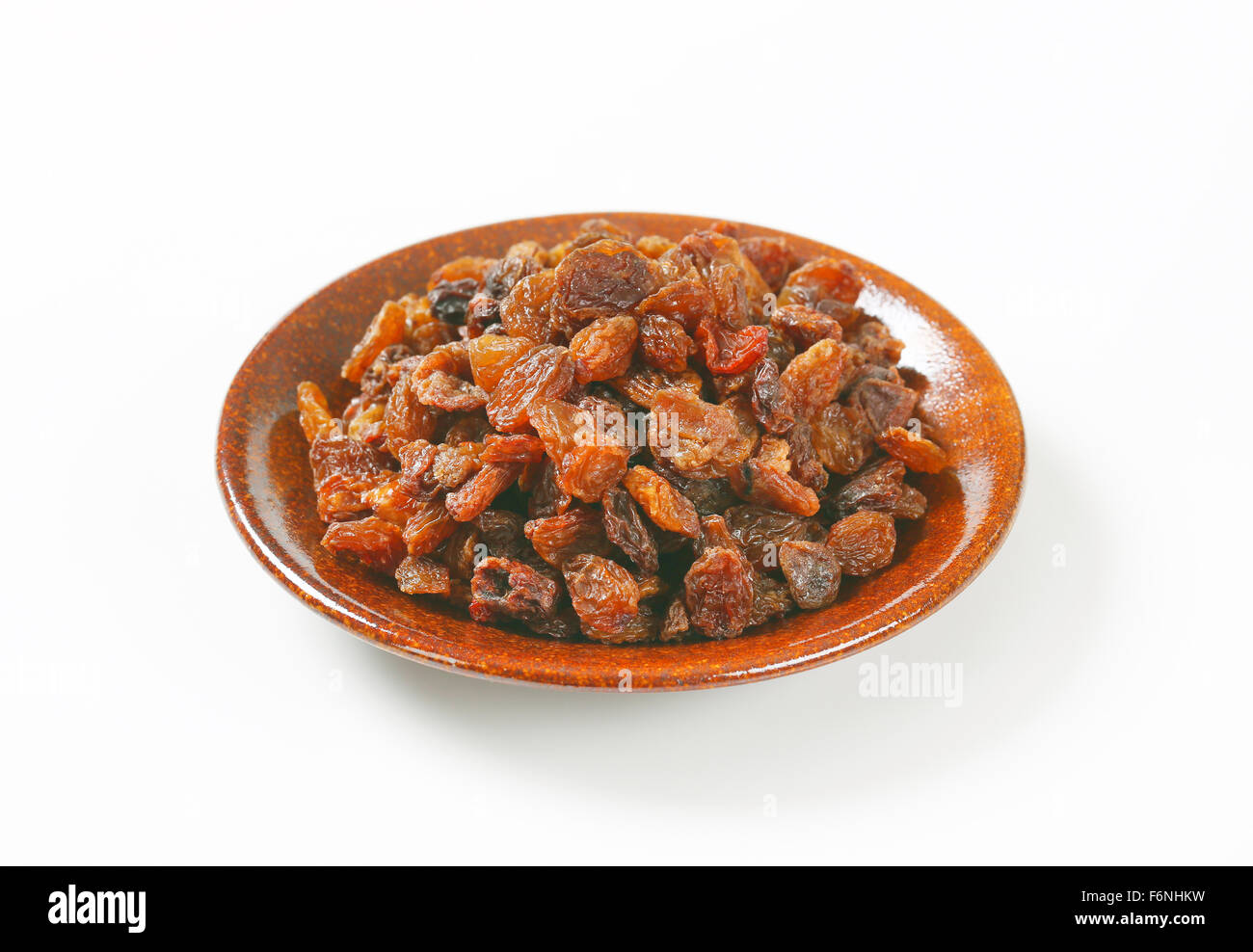 plate of raisins on white background Stock Photo - Alamy