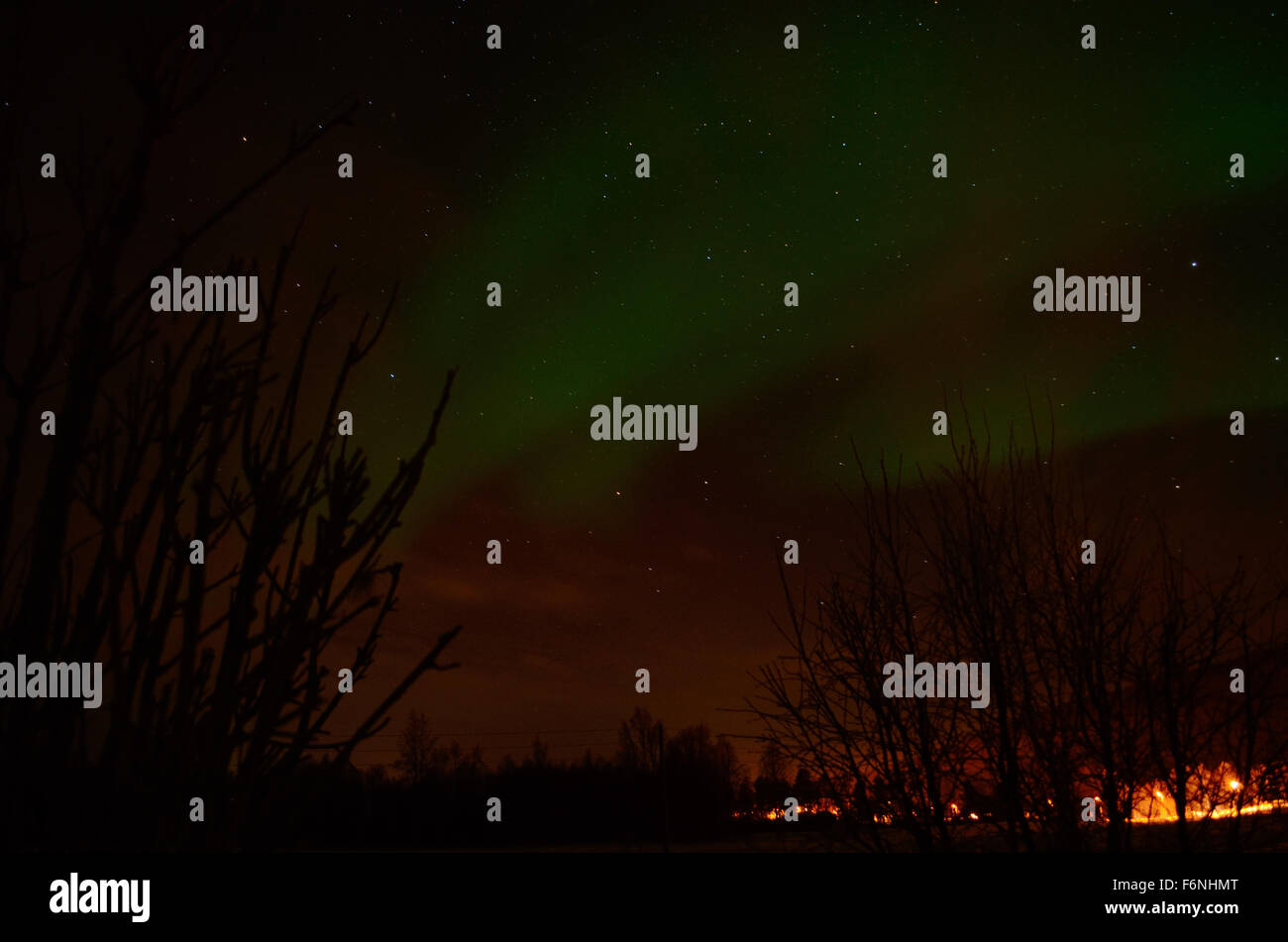 aurora borealis, northern light on a fire red sky in the arctic circle ...