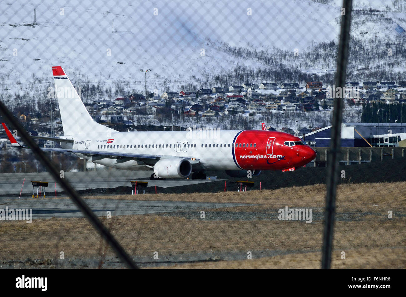 norwegian airplane getting ready to take off from the airport runway ...