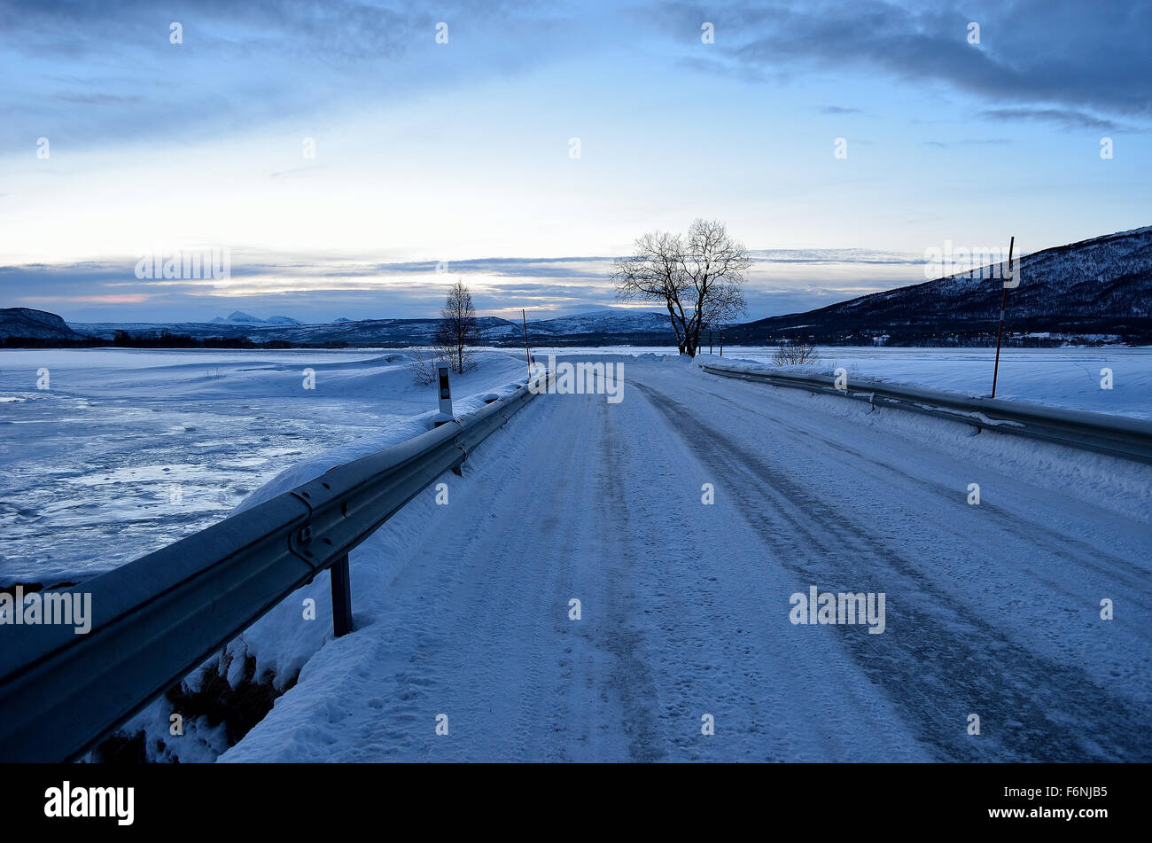 snowy winter road with mountain and snowy field background Stock Photo ...