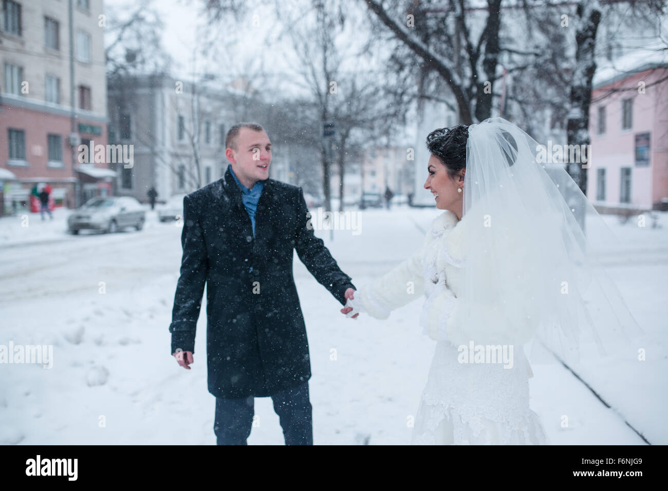 Bride and groom walking Stock Photo - Alamy
