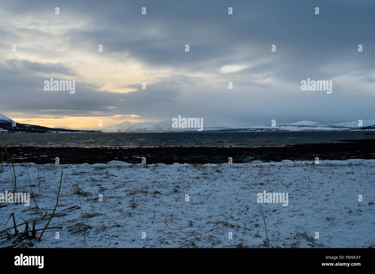 long sea and snowy field with mountain Stock Photo - Alamy