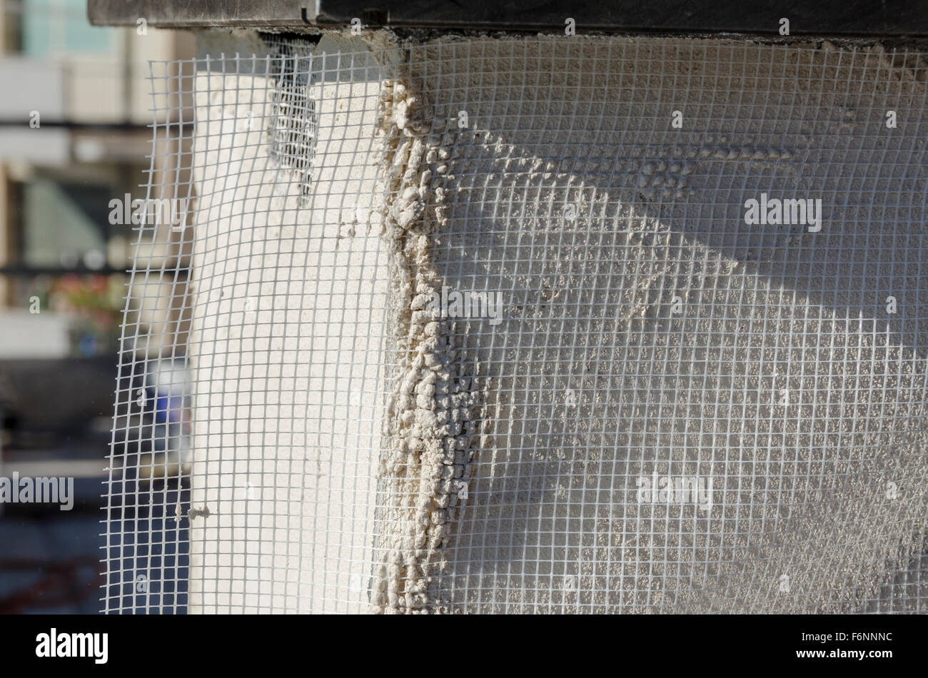 workman during the laying of a reinforcing mesh for plaster Stock Photo ...