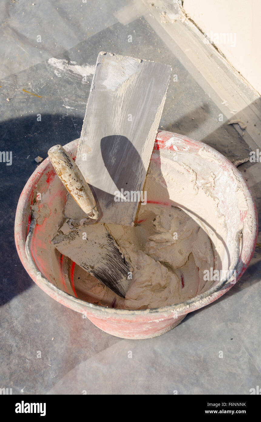 bucket with cement and tools for a construction site Stock Photo - Alamy