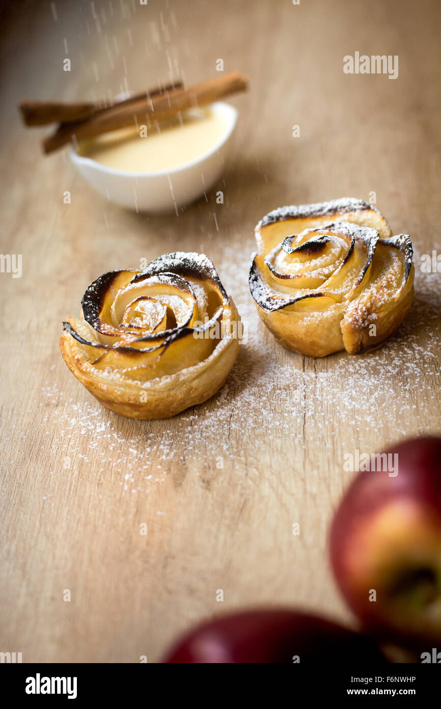 rose-shaped baked pastry with powdered sugar on the move, vanilla ...