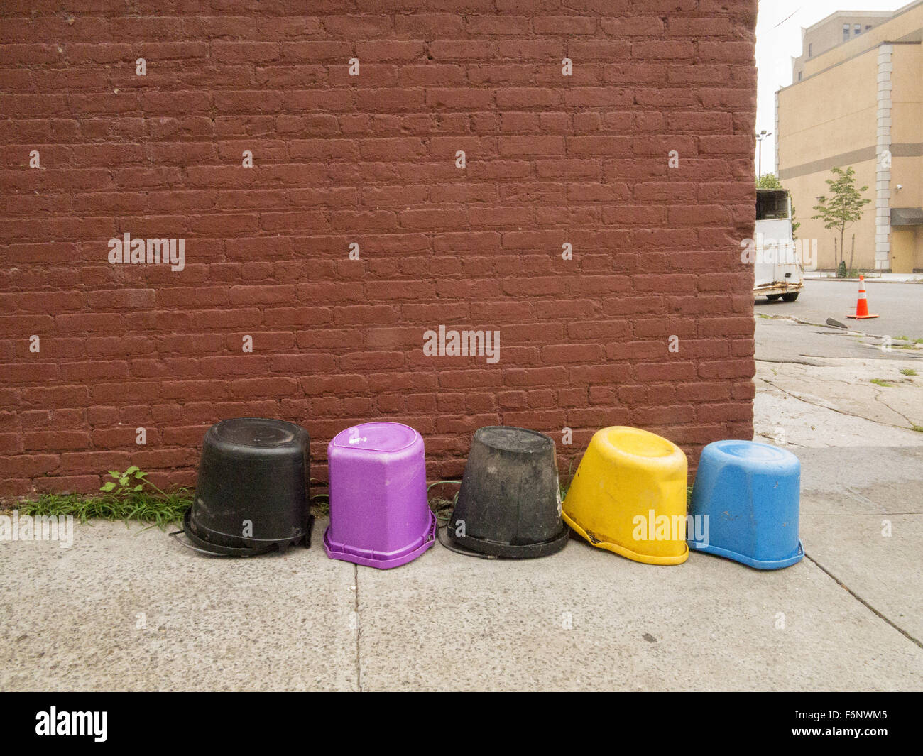 Colorful pails outside the Kensington Stables in Brooklyn, New York ...