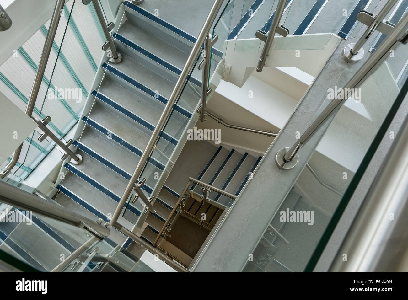 Modern staircase with glass walls Stock Photo - Alamy