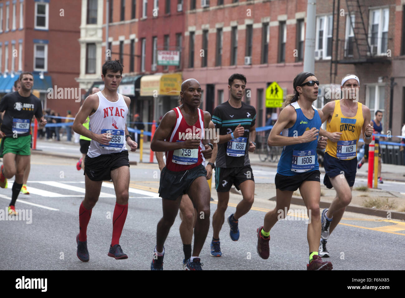 Runners race up 4th Avenue through Park Slope Brooklyn during the 1st ...