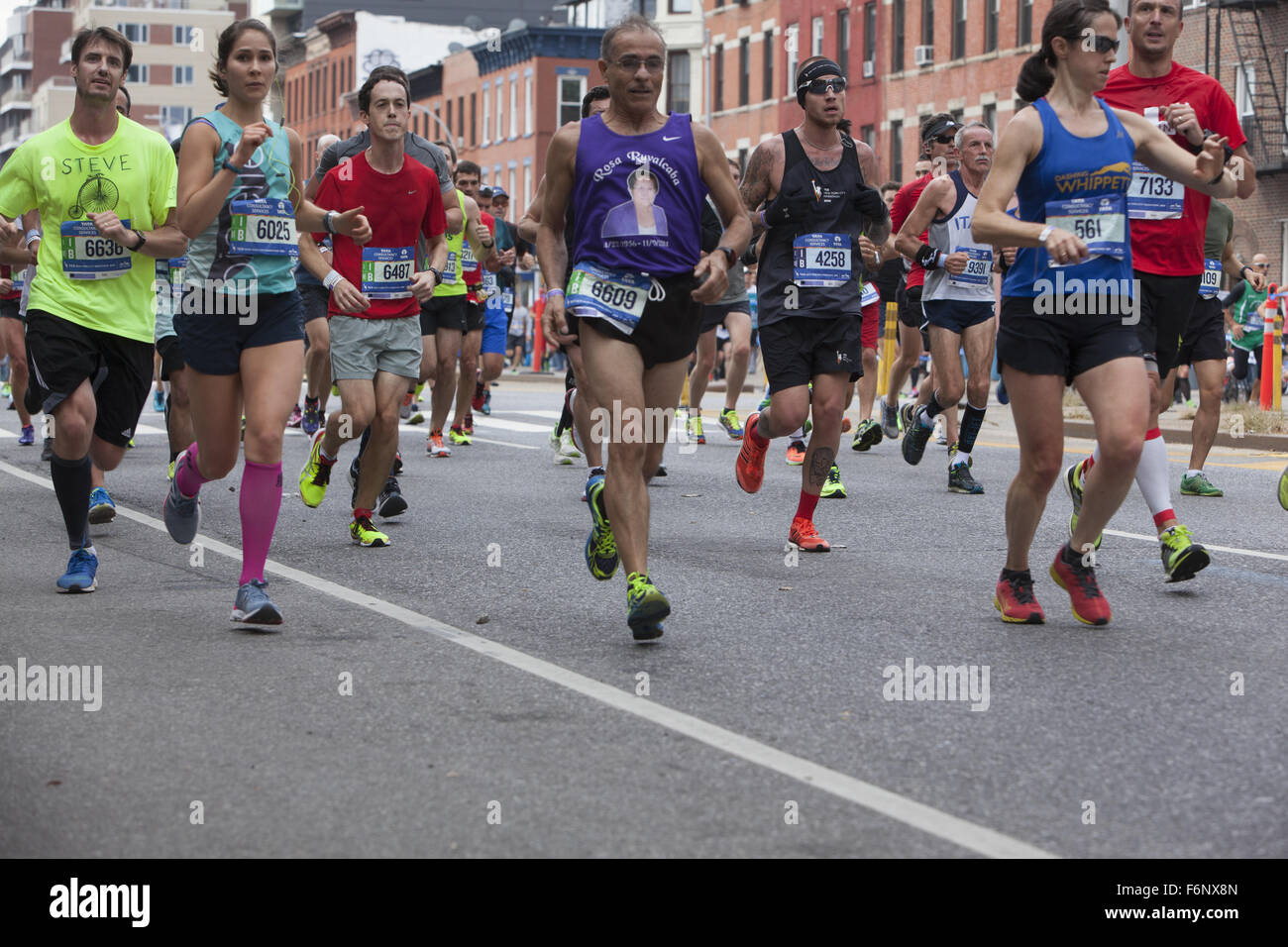 Runners race up 4th Avenue through Park Slope Brooklyn during the 1st ...