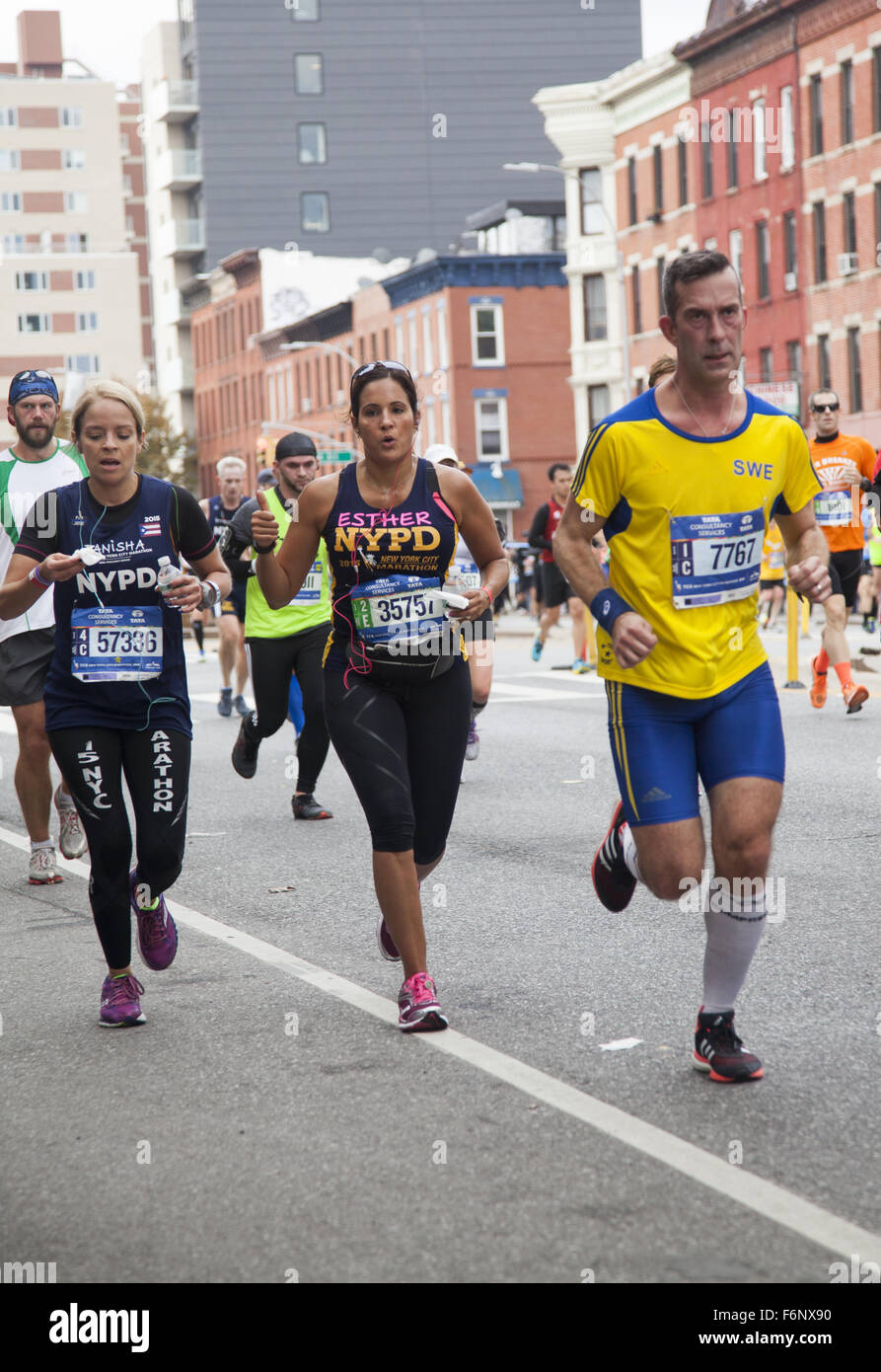 Runners race up 4th Avenue through Park Slope Brooklyn during the 1st ...