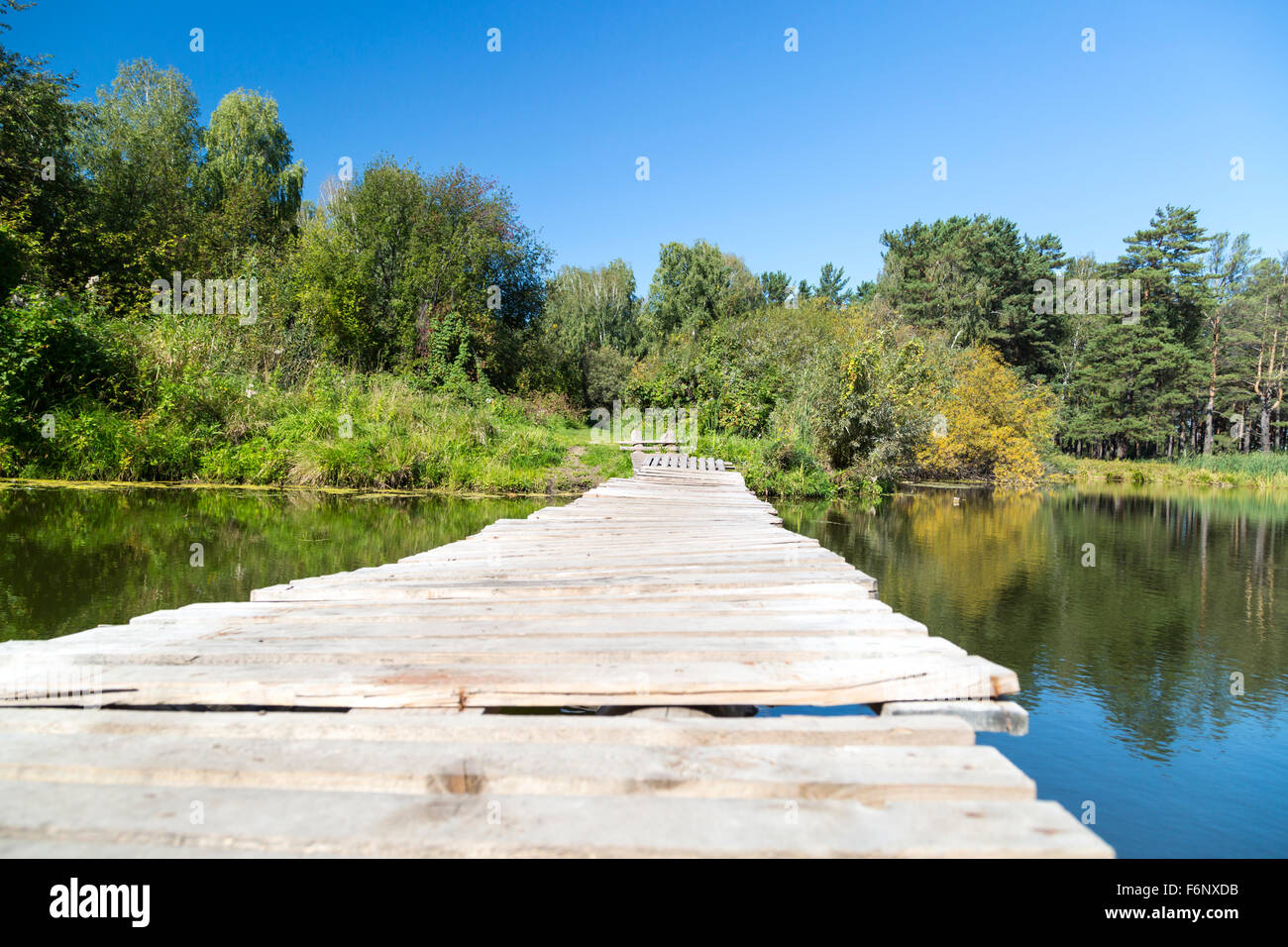 The old makeshift bridge connecting the two banks of lake Stock Photo ...